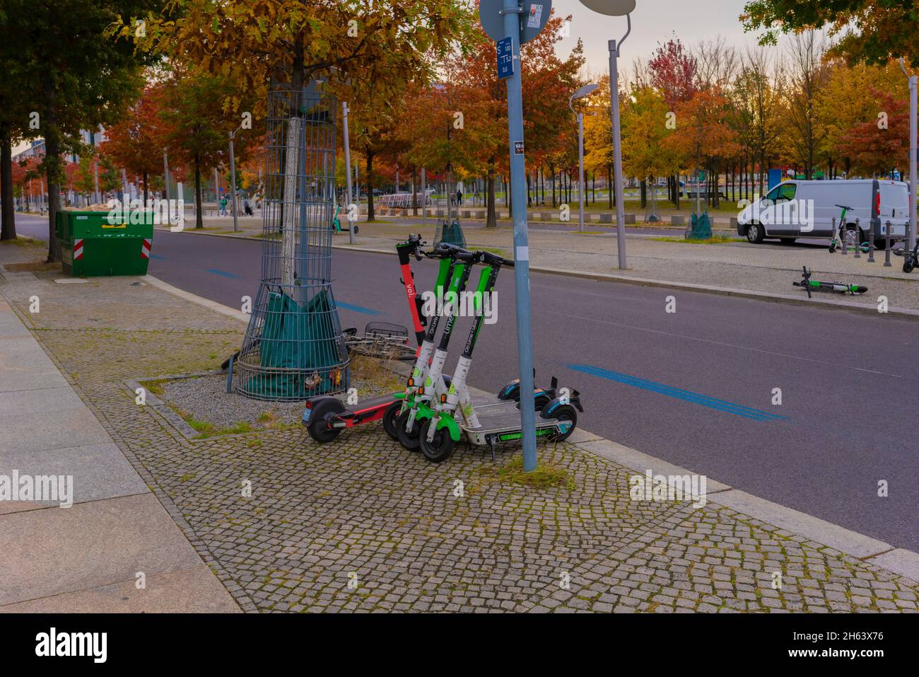 germany,berlin,e-scooters parked on the side of the road in berlin in ...