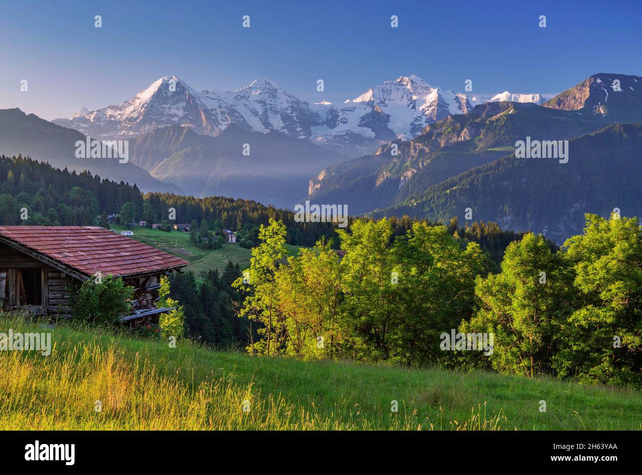mountain hut against the three peaks of the eiger 3967m,mönch 4107m and ...