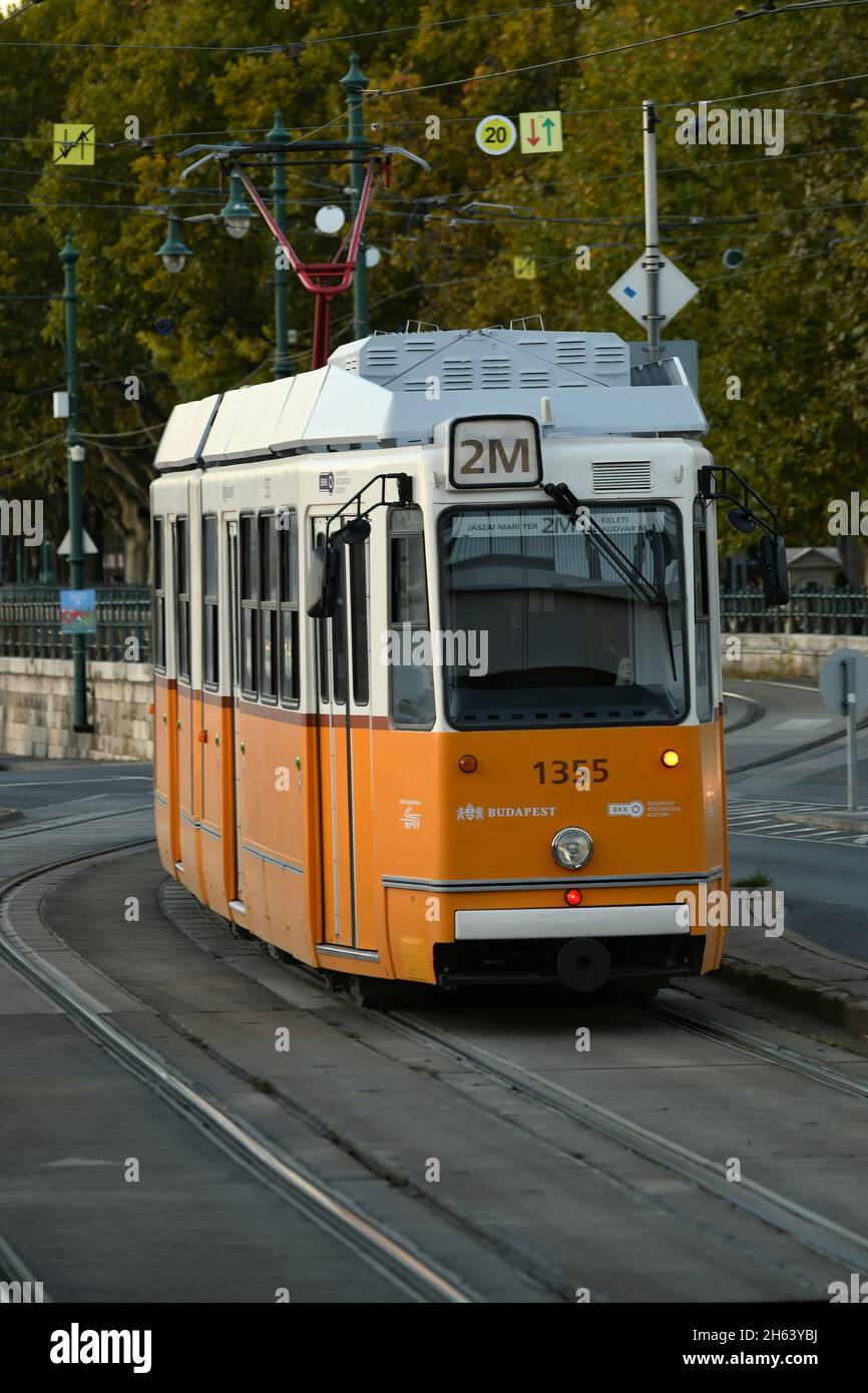 Traditional yellow tram in Budapest at the river of Danube Stock Photo ...