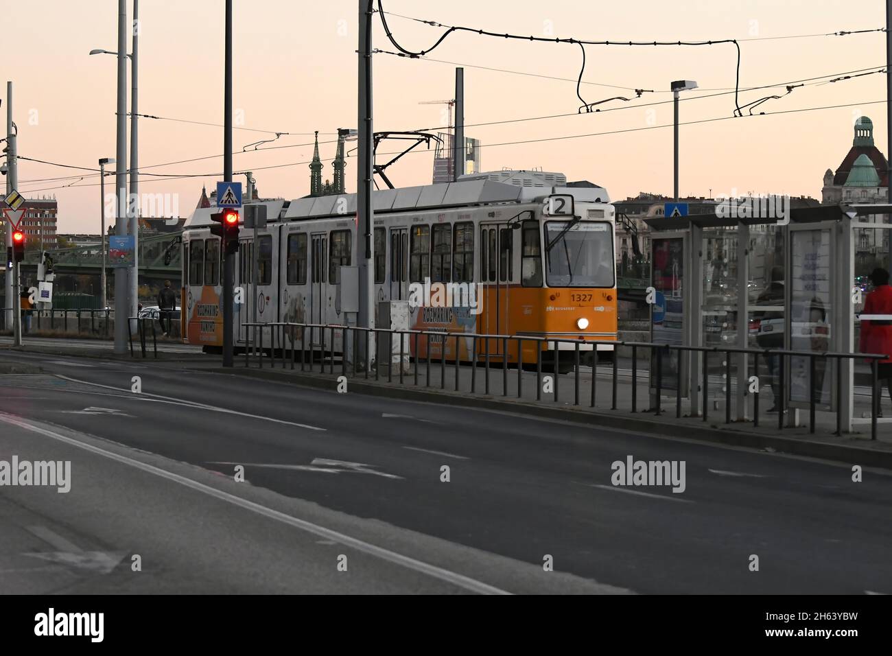 Traditional tram in Budapest at the "rakpart" arriving to the stop ...