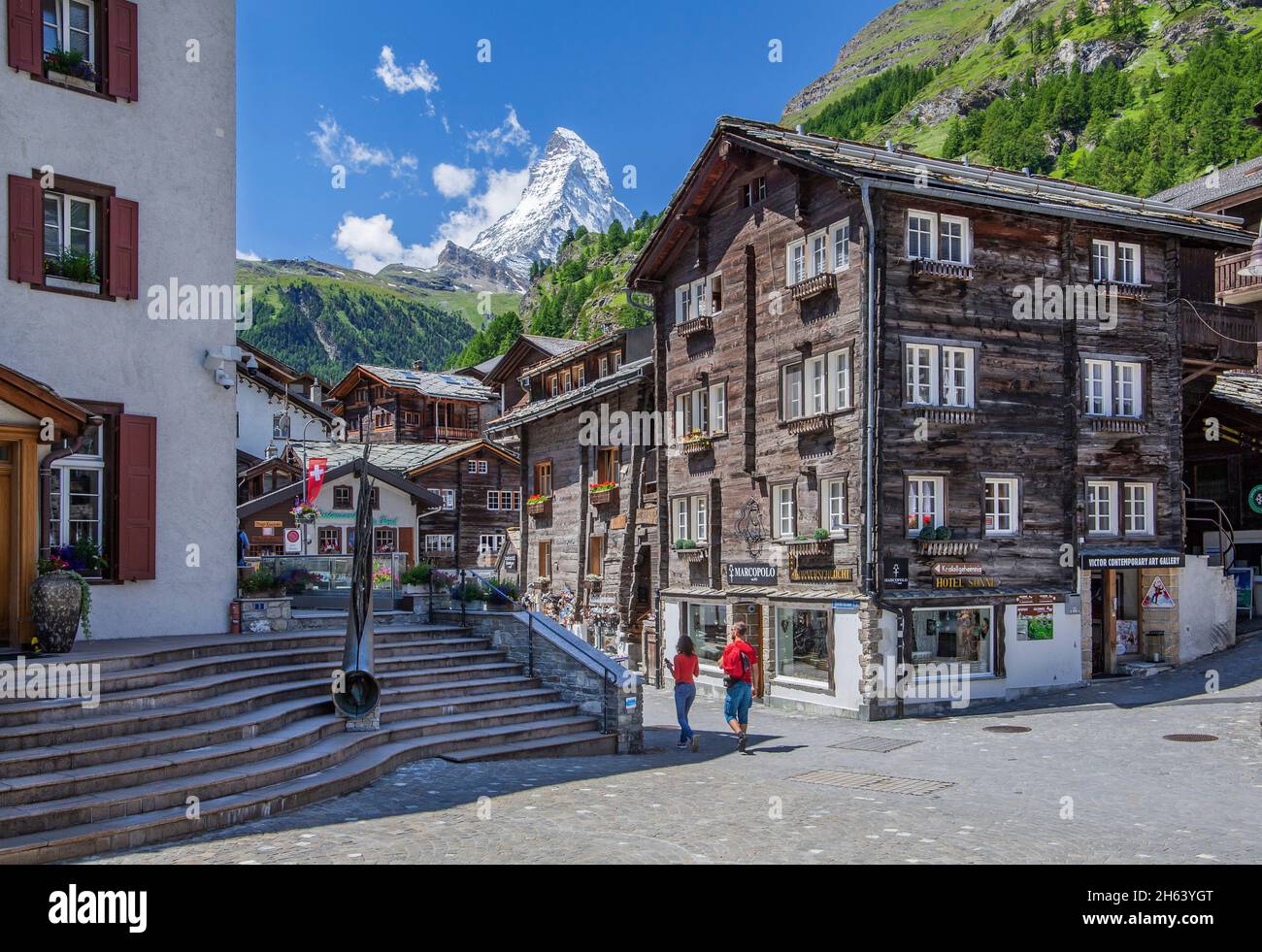 typical old valais houses in the center of the village against ...