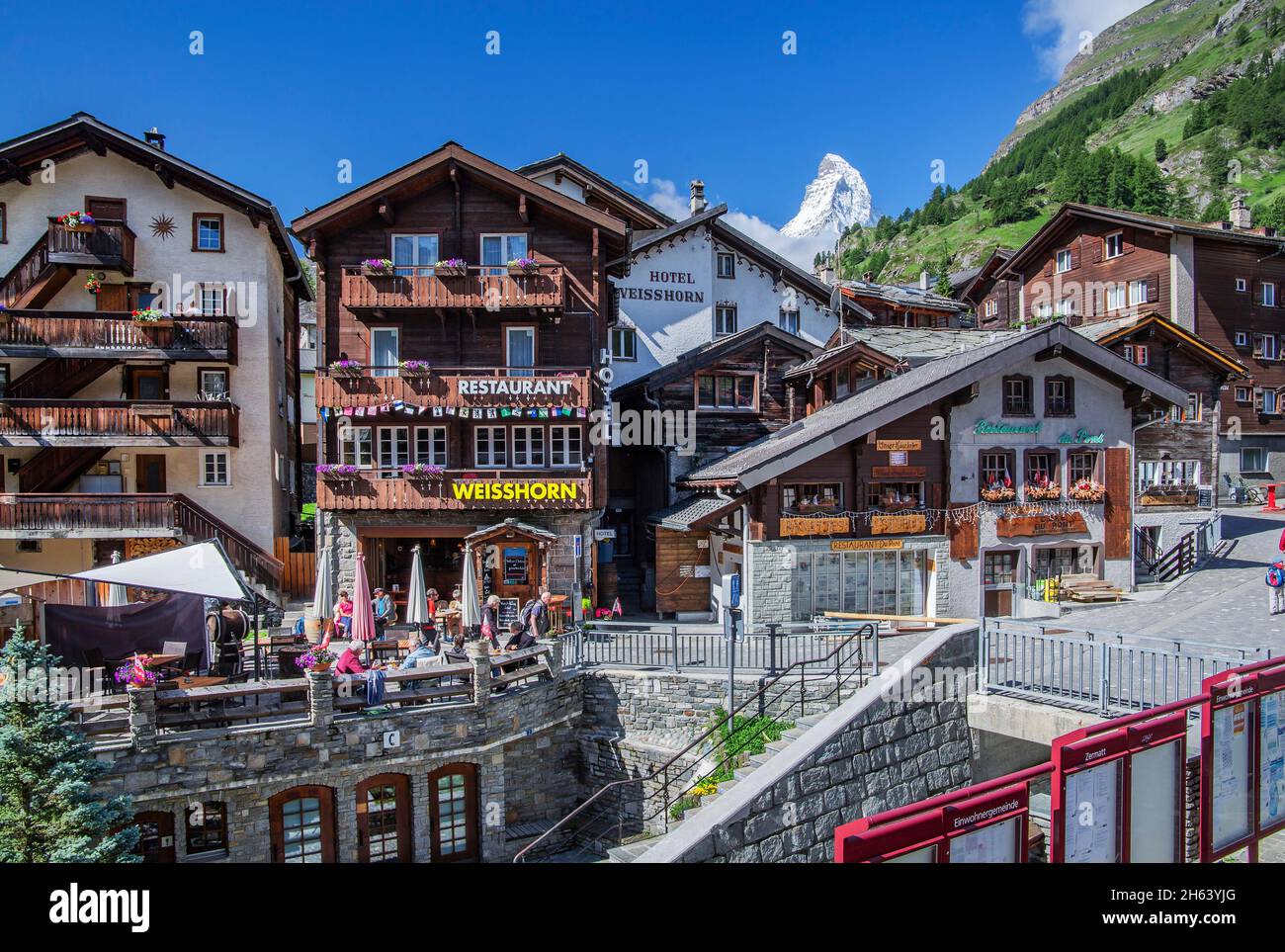 typical old valais houses in the center of the village against ...