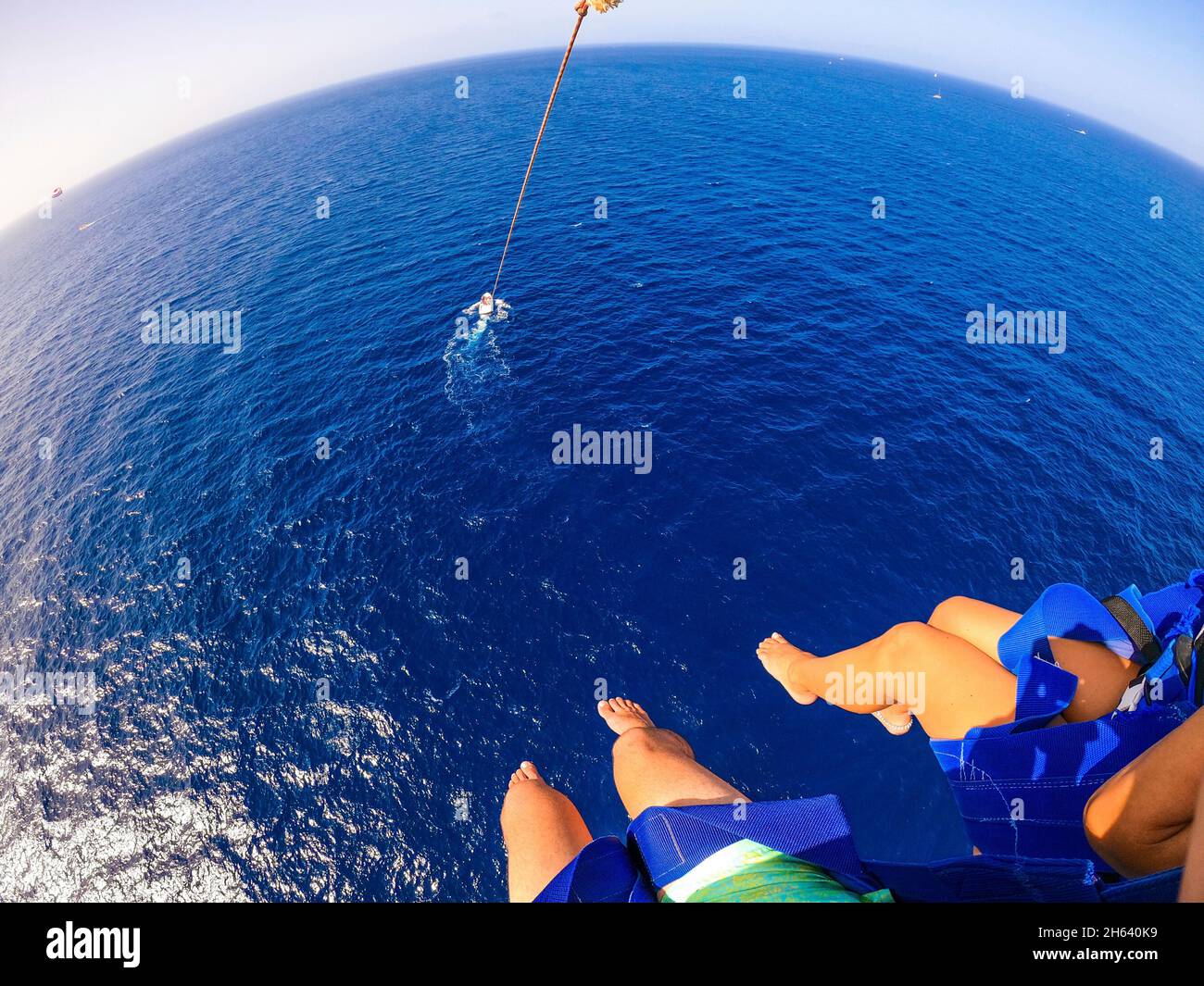 aerial and very high view of sea or ocean with sun in a sunny day at ...