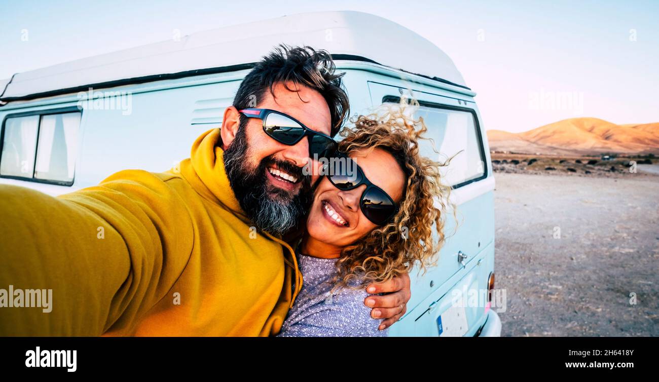 happy adult couple smile and have fun together taking selfie picture ...
