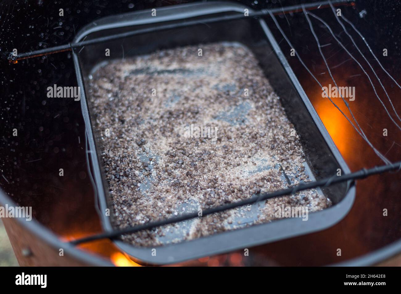make your own smoked salt over the fire Stock Photo - Alamy