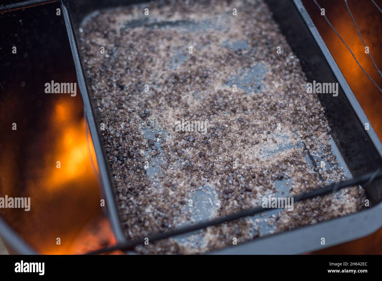 make your own smoked salt over the fire Stock Photo - Alamy