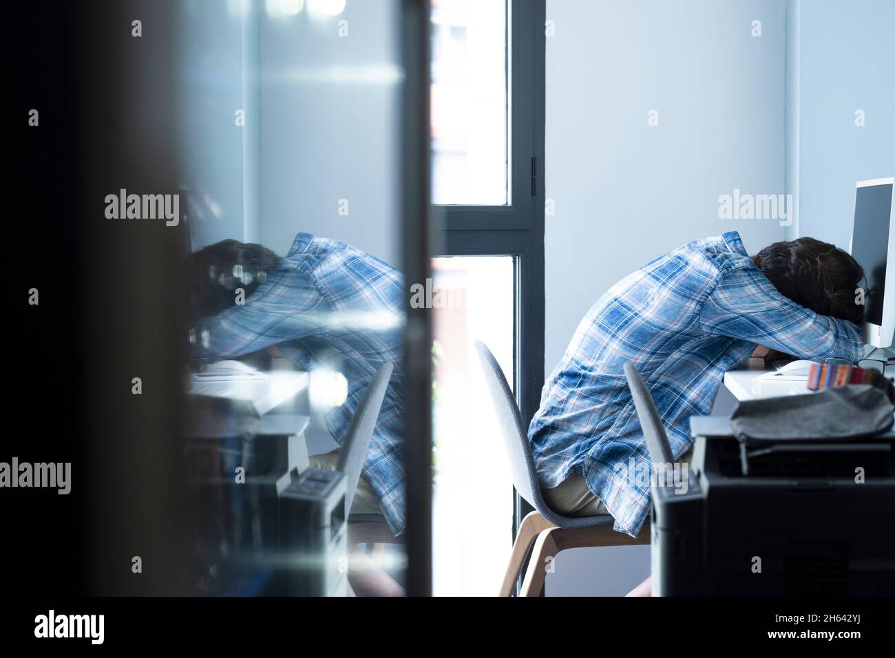 tired businessman sleeping while working on desktop computer. man ...