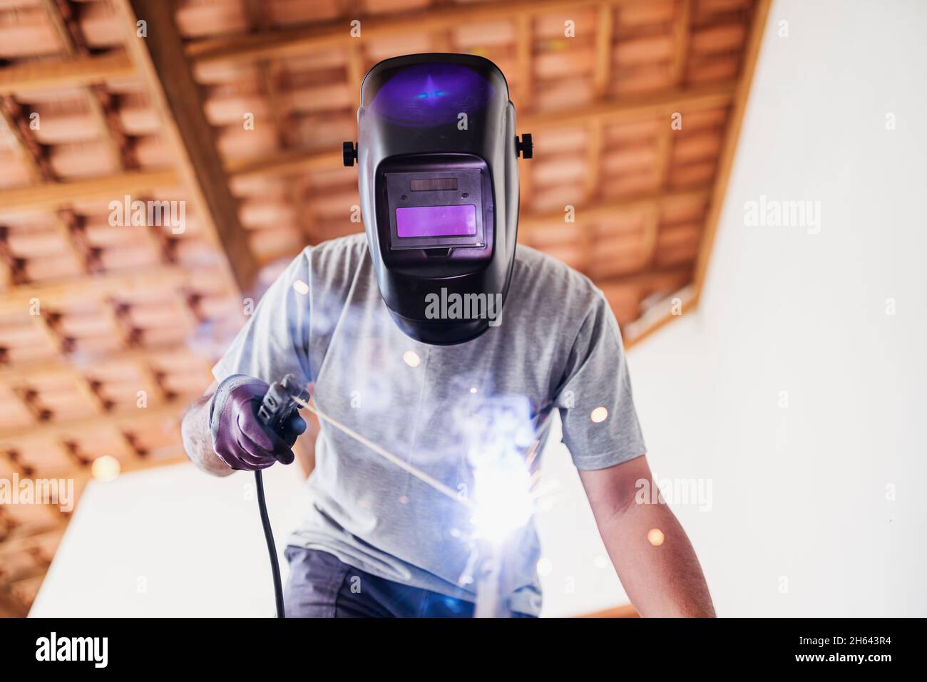 Close up portrait view of protected professional mask welder man ...