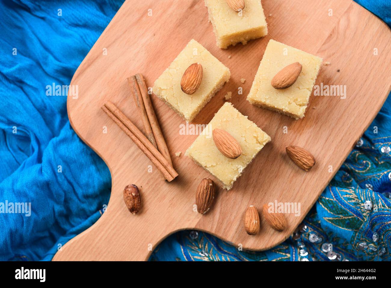 Homemade Indian sweets, halva wih cinnamon and almonds served on ...