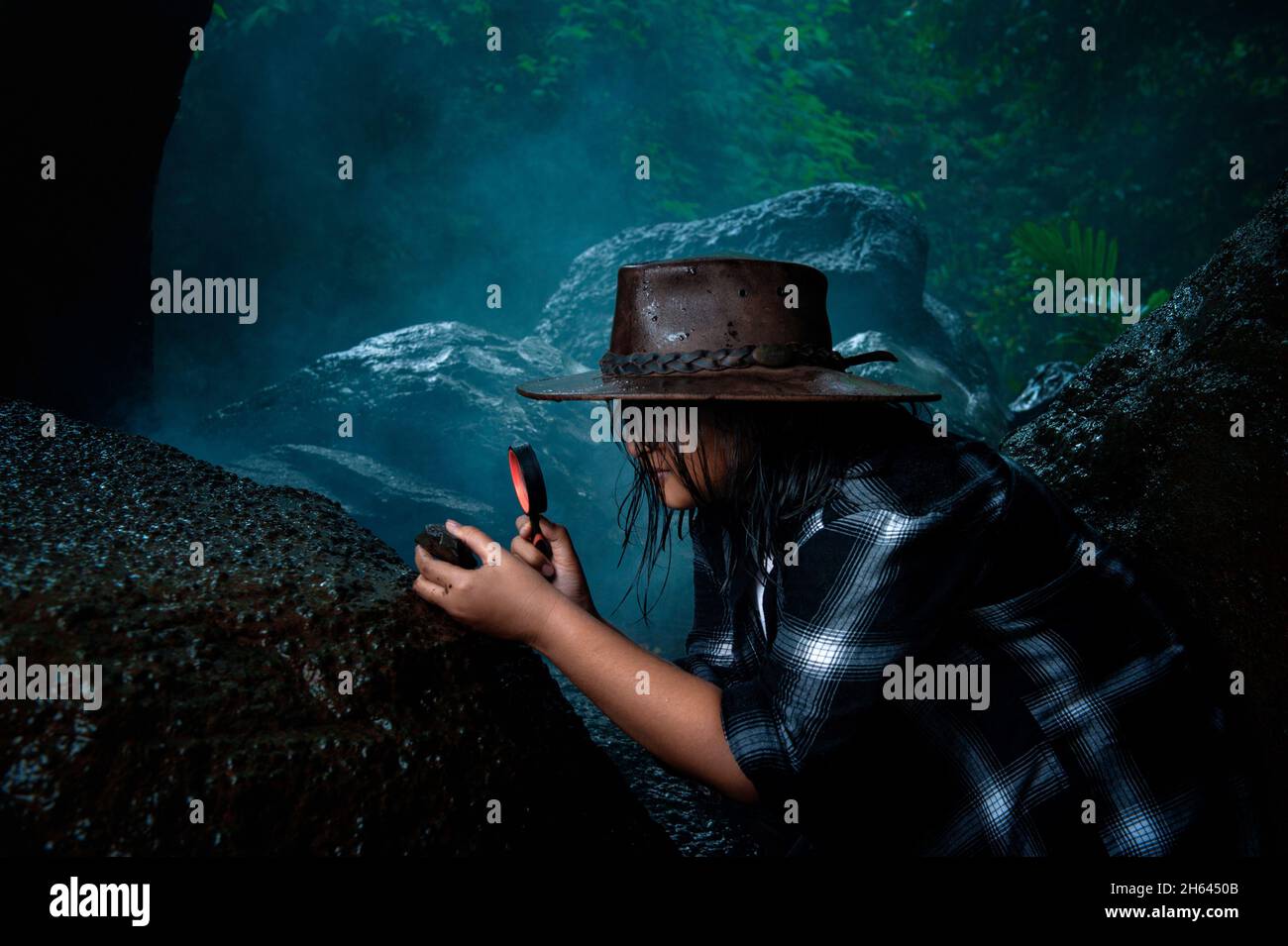 Student girl doing research in the forest as the background Stock Photo ...