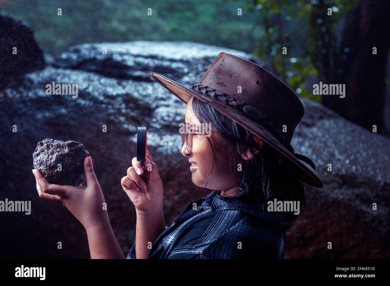 Student girl doing research in the forest as the background Stock Photo ...