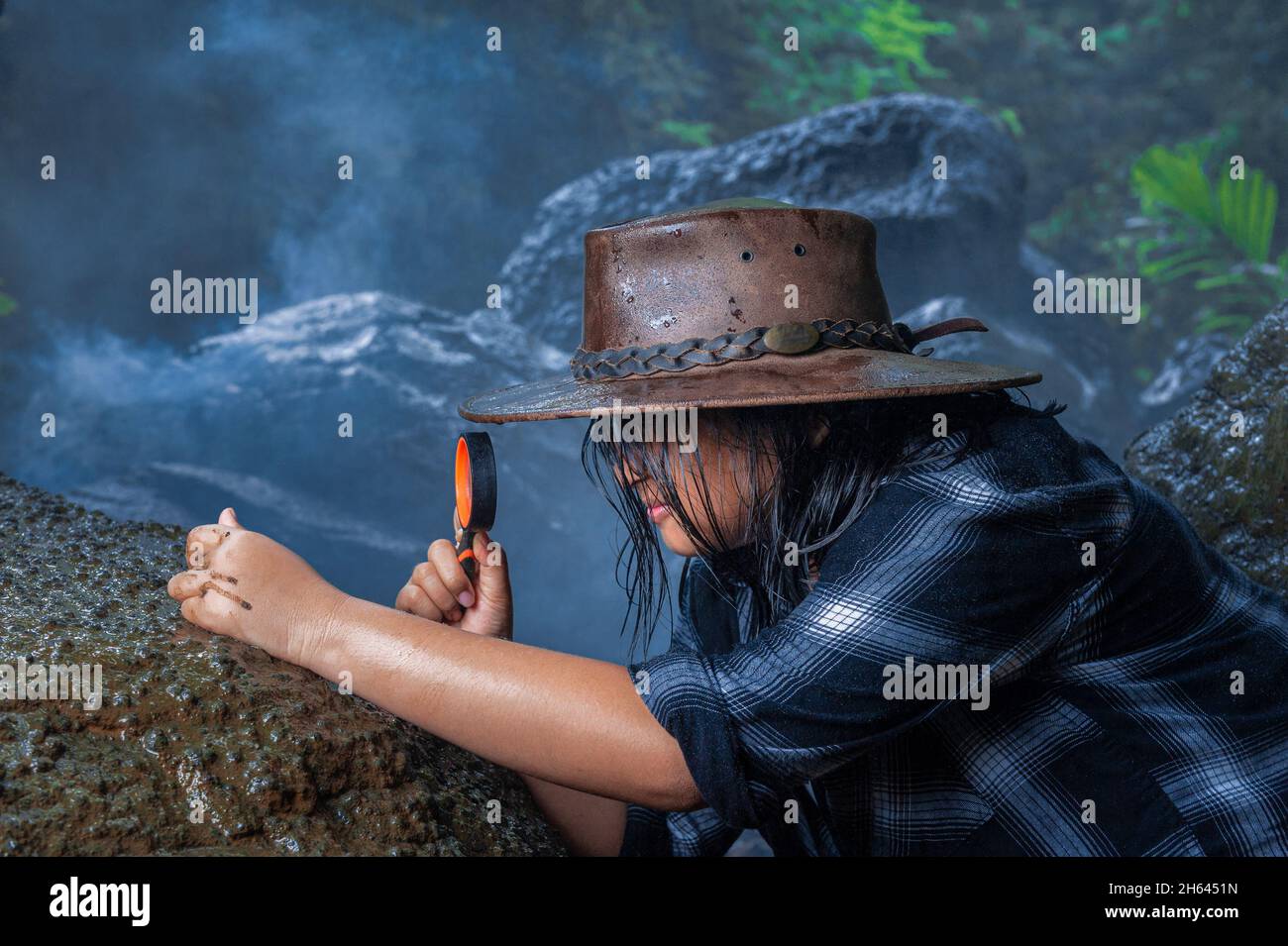 Student girl doing research in the forest as the background Stock Photo ...