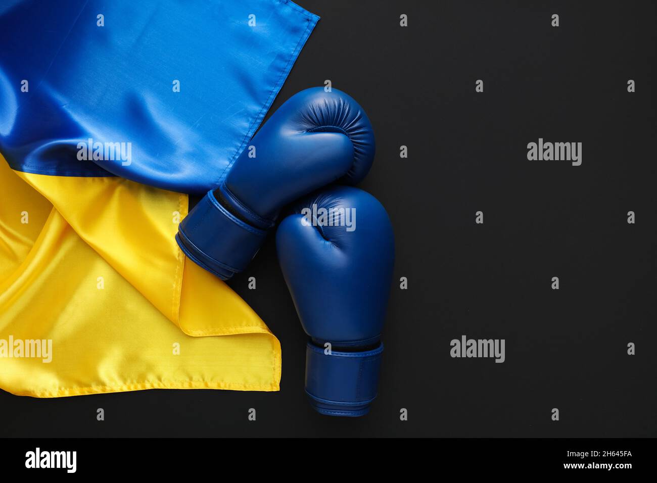 Boxing gloves and flag of Ukraine on black background Stock Photo - Alamy