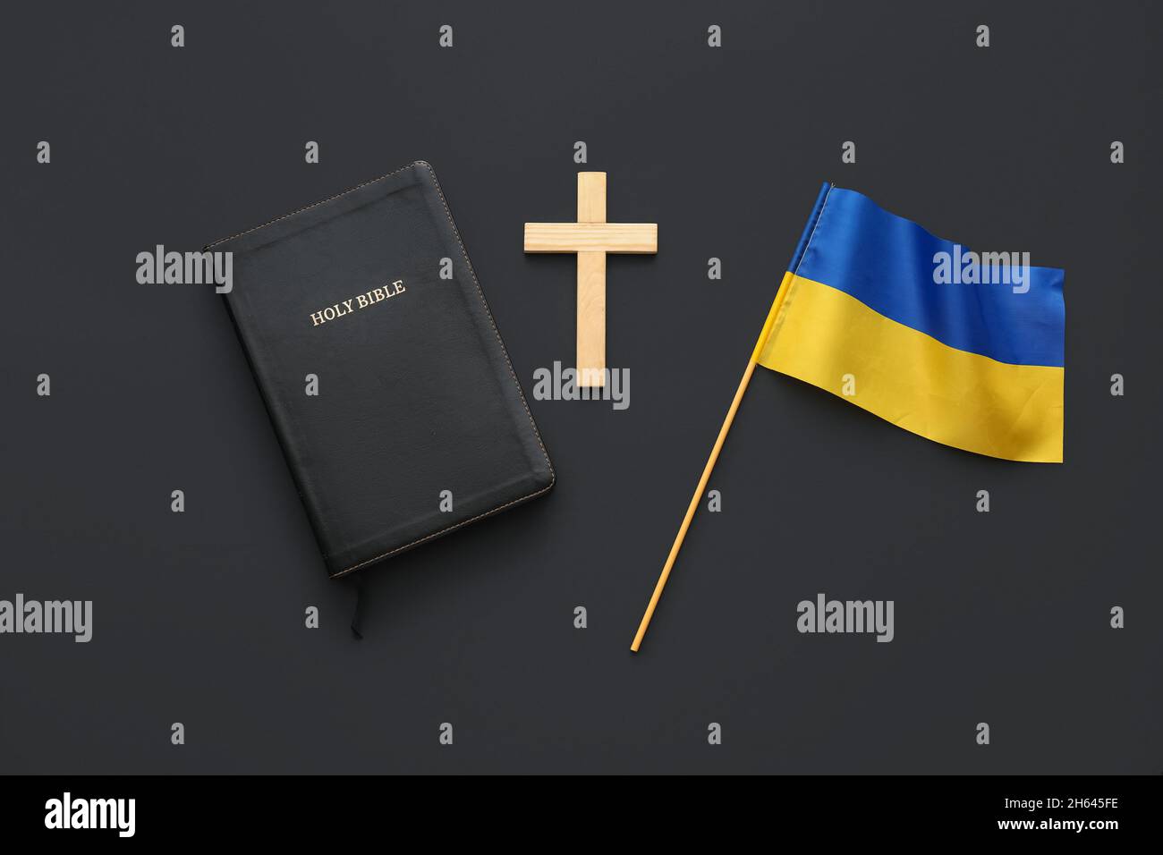 Holy Bible with cross and flag of Ukraine on black background Stock ...