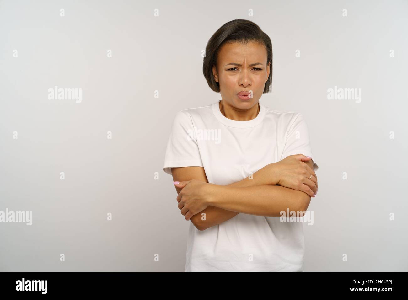 Unpleased black woman look with disgust hold folded hands dissatisfied ...