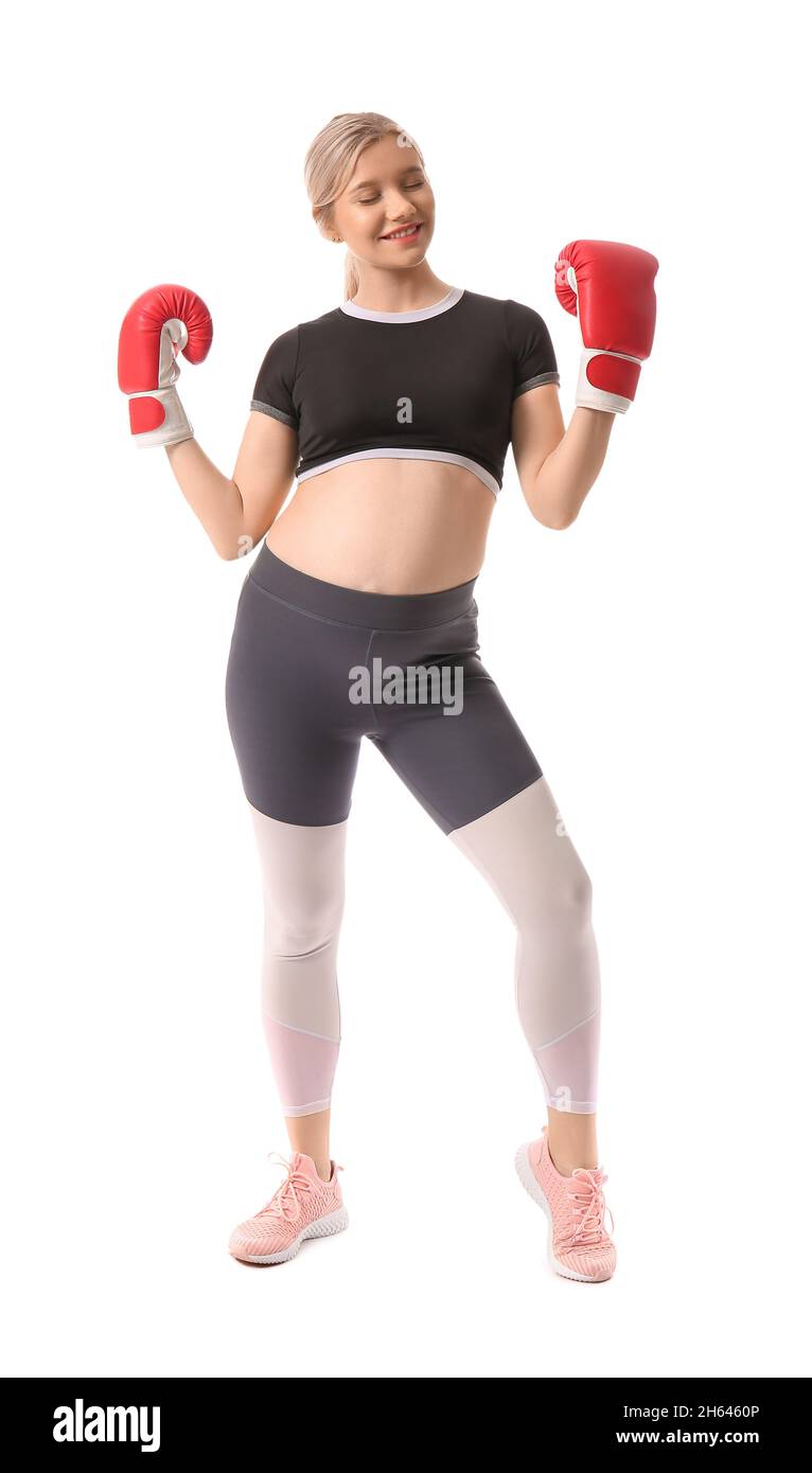 Young pregnant woman in boxing gloves on white background Stock Photo ...