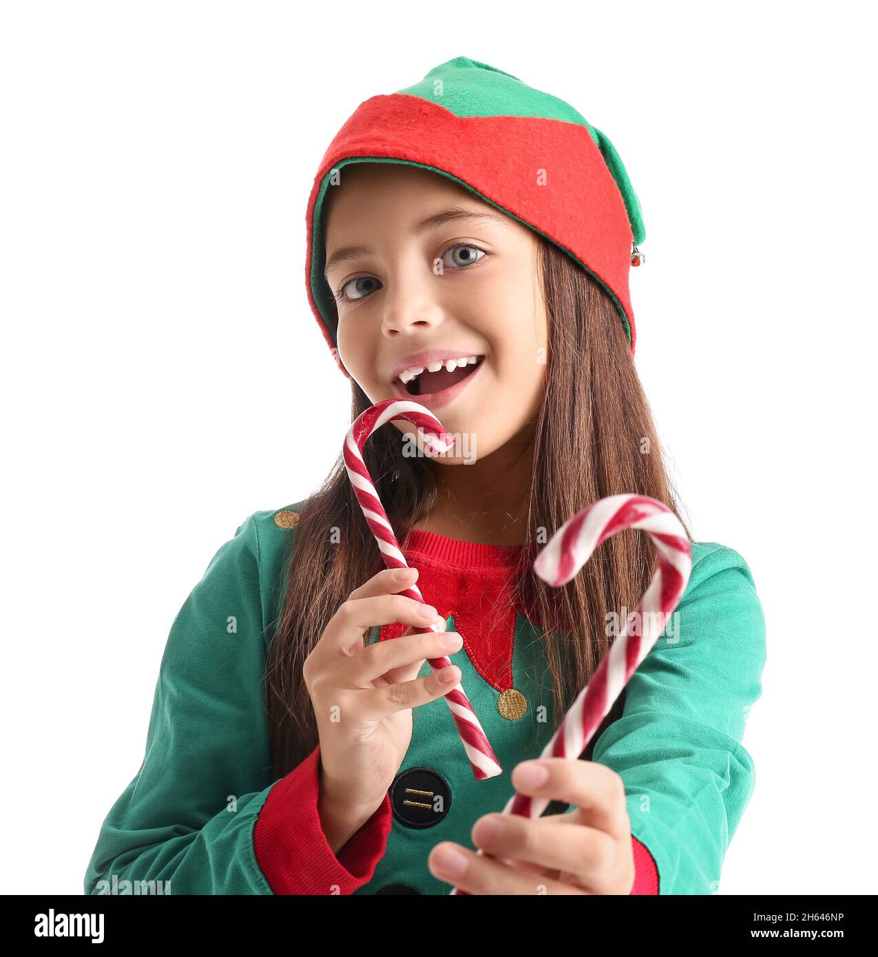Cute little elf with candy canes on white background Stock Photo - Alamy