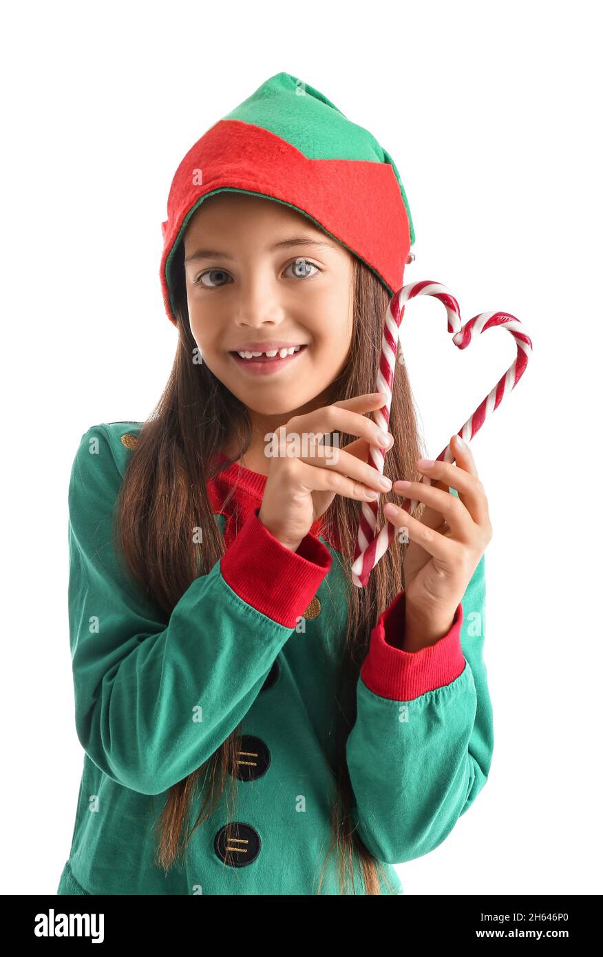 Cute little elf with candy canes on white background Stock Photo - Alamy