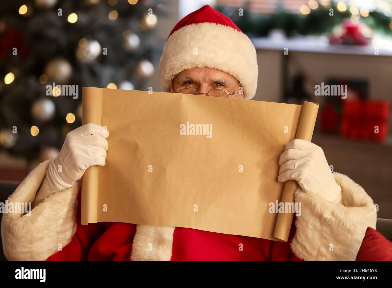 Santa Claus with empty letter at home on Christmas eve Stock Photo - Alamy