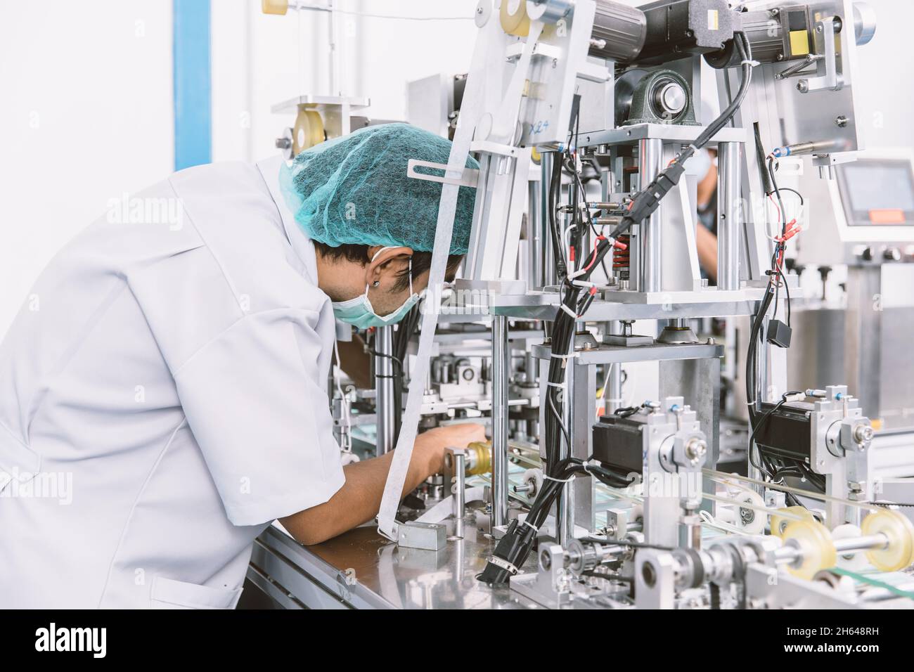 engineer worker fix service modern machine in hygiene medical factory ...