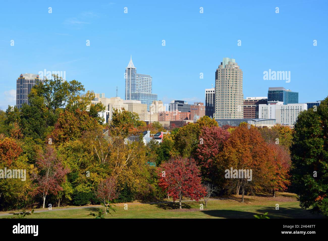 The downtown Raleigh skyline rises above autumn trees from the Dorothea ...