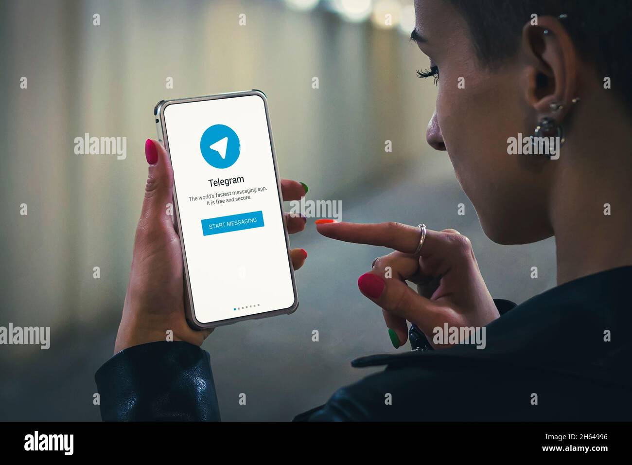 a young pretty woman launches a modern telegram messenger. Telegram ...