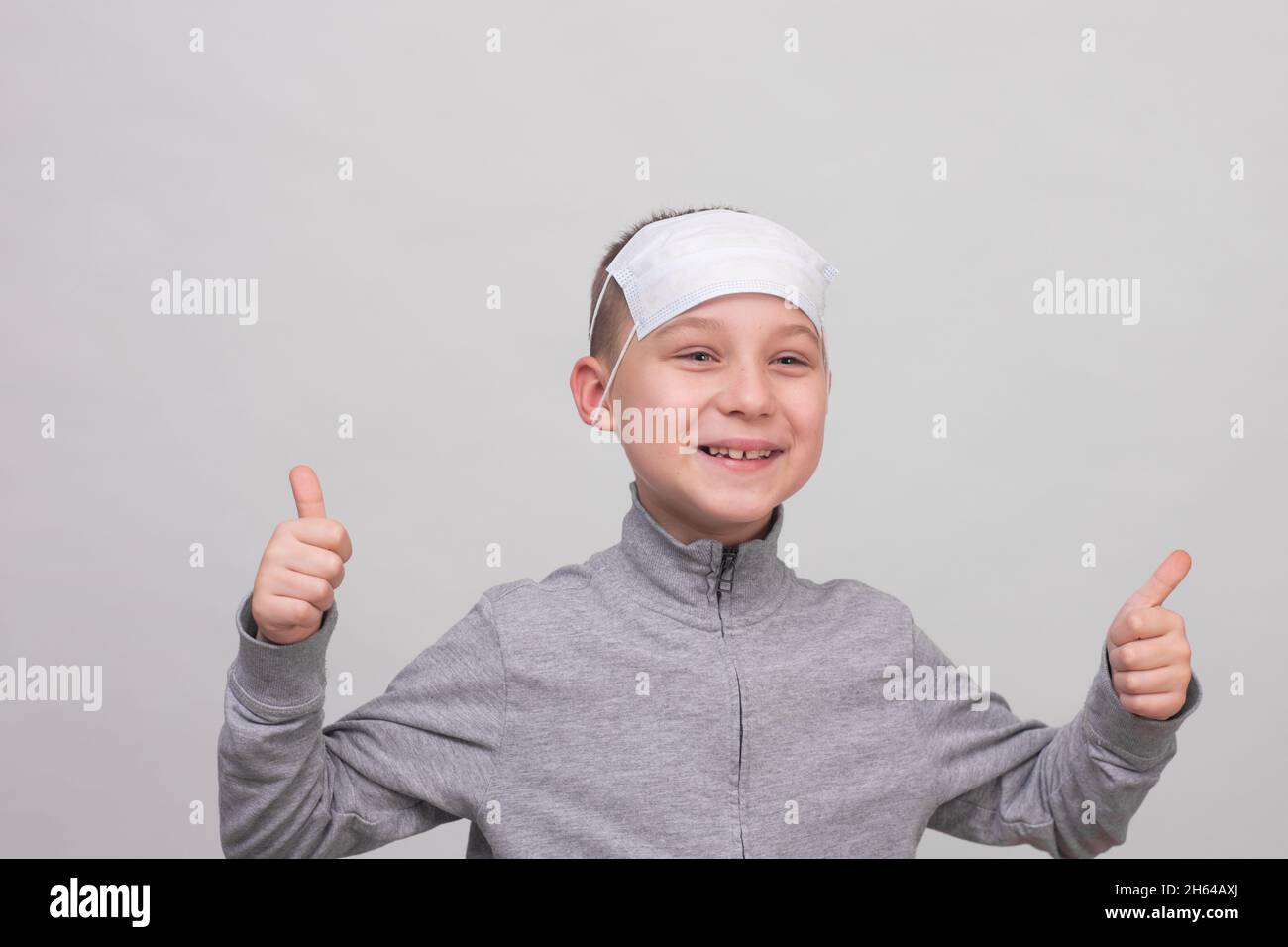a cute 8-10 year old boy is smiling Stock Photo - Alamy