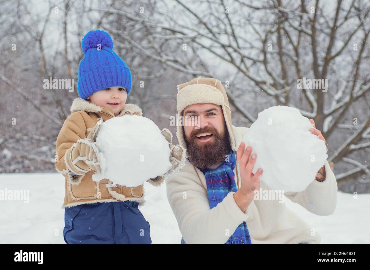 Man boy playing snowballs hi-res stock photography and images - Alamy