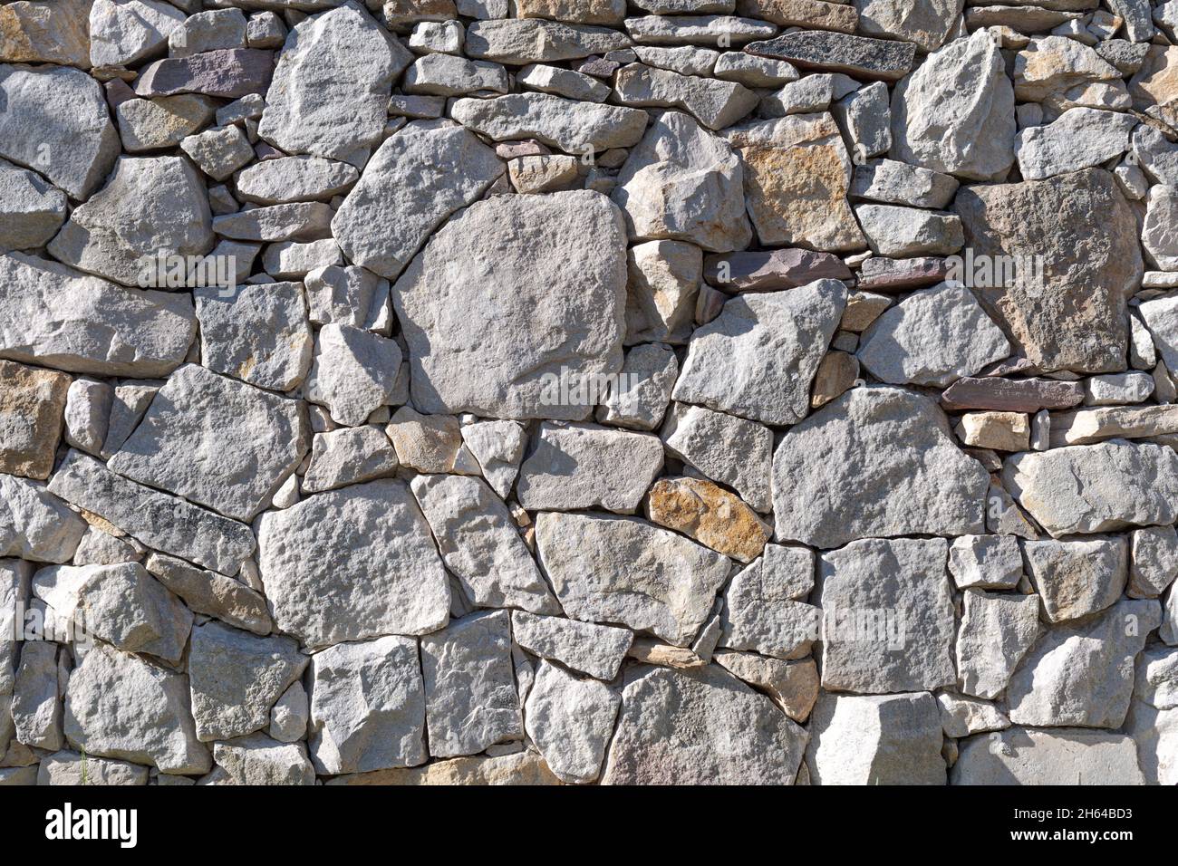 View of Rustic stone wall with irregular shapes Stock Photo - Alamy