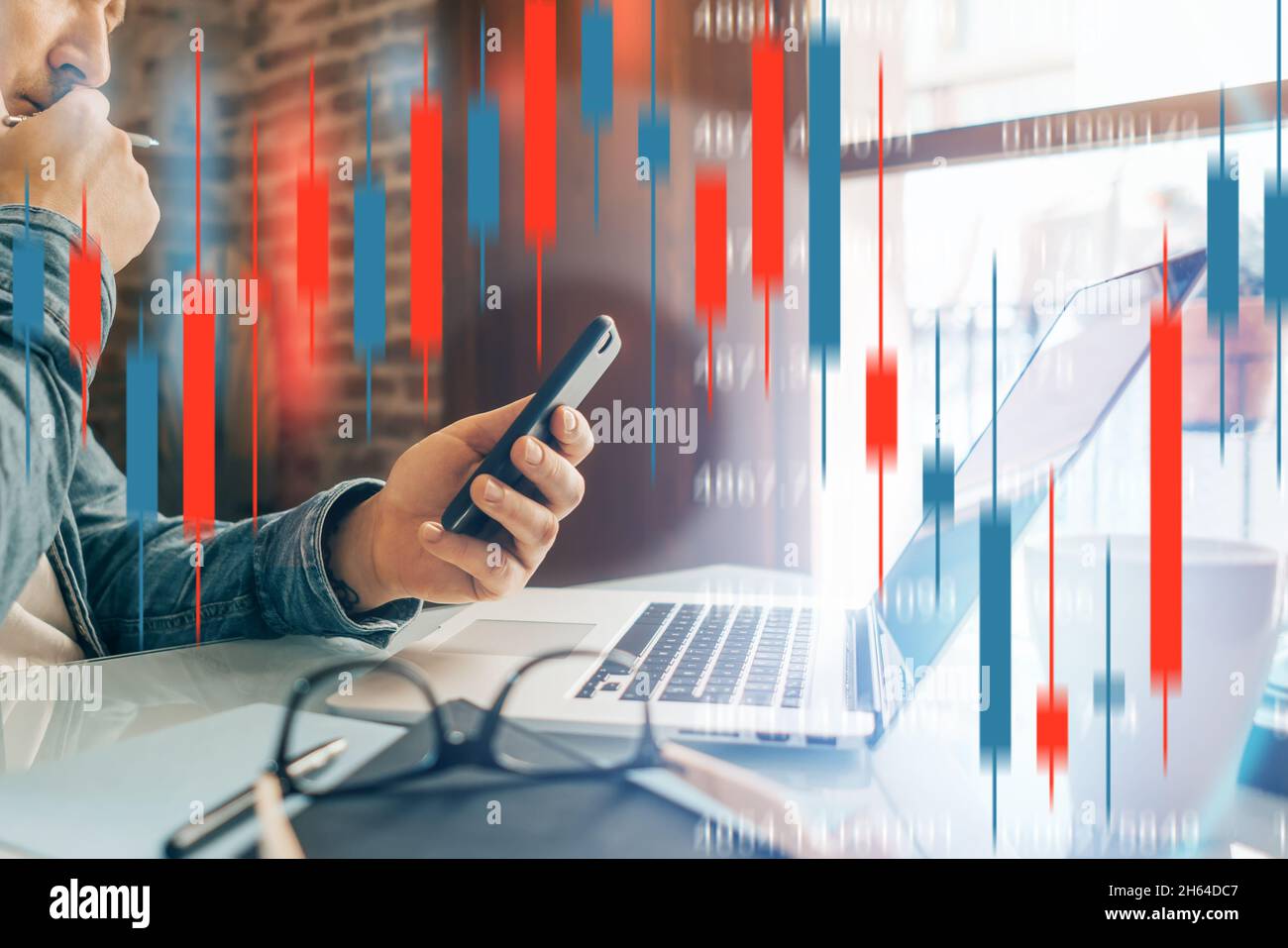 Businessman working remotely from home. Technical price graph and ...