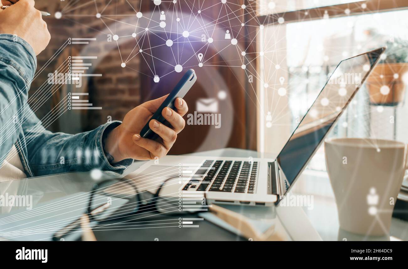 Close-up photo of male hands with laptop. Man working remotely at home. Concept of networking or ...