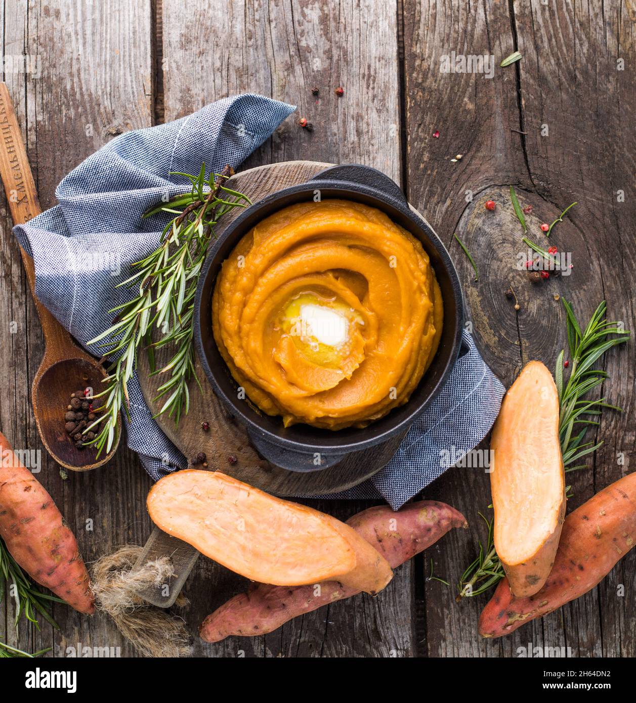 Spicy mashed sweet potato or sweet potato puree with rosemary in a ...