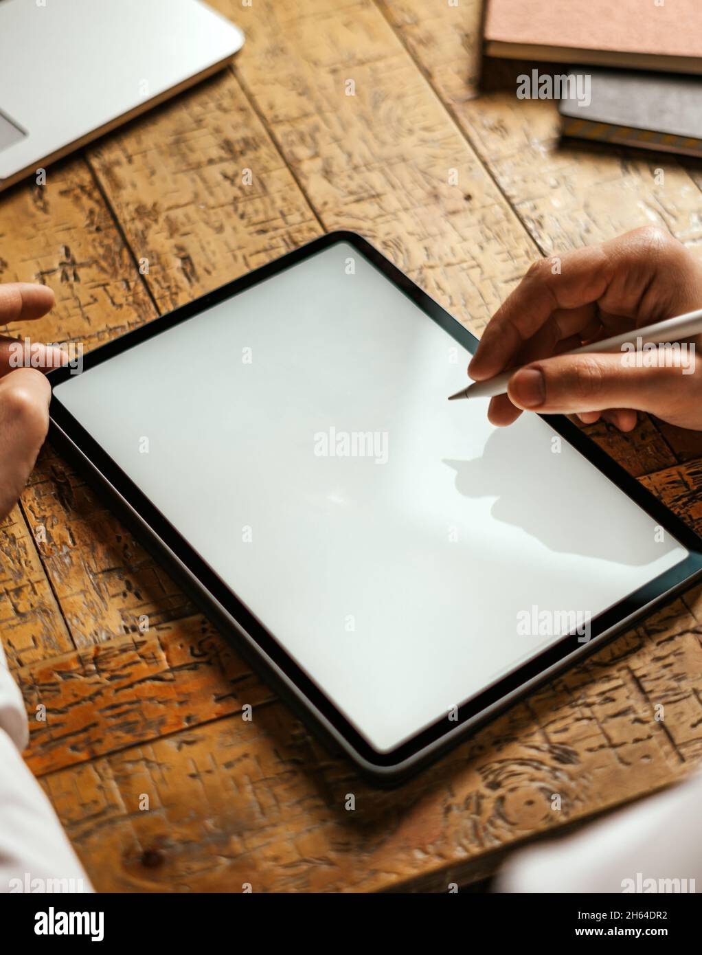 Close up photo of male hands drawing on digital tablet with electronic ...