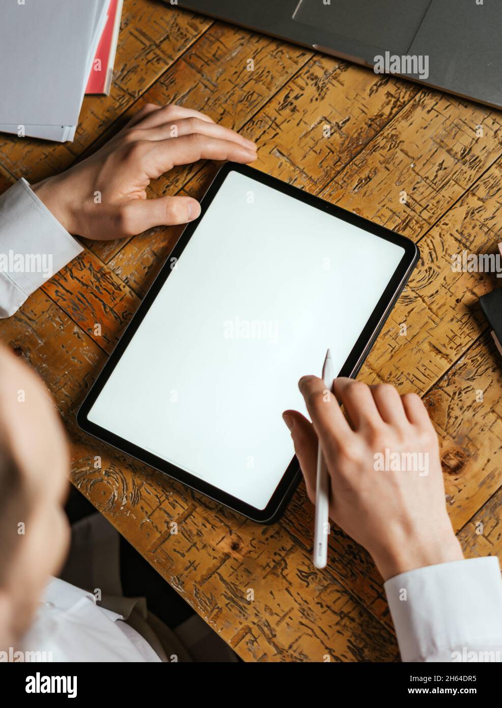 Close up photo of male hands drawing on digital tablet with electronic ...