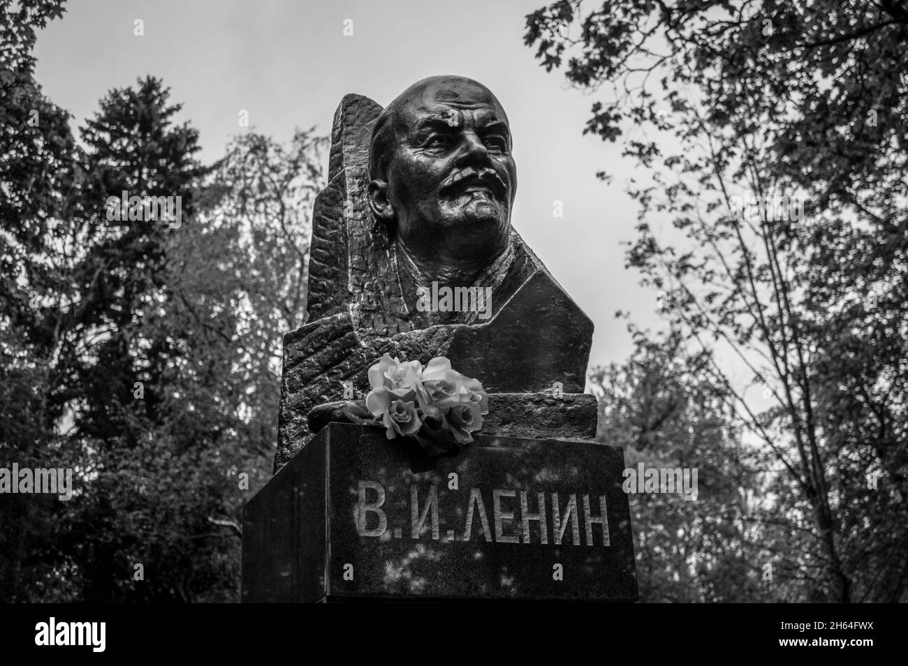 Monument to Vladimir Lenin against trees in the rural area of Sortavala ...