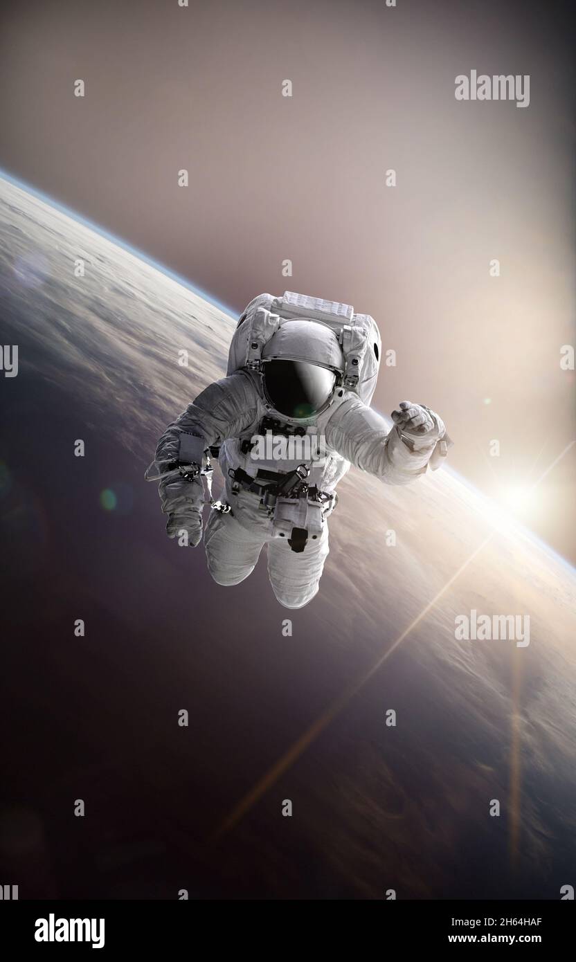 Astronaut in outer,open space over the planet Earth.Stars provide the ...
