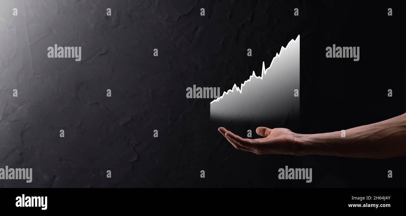 Businessman holding graph growth and increase of chart positive ...