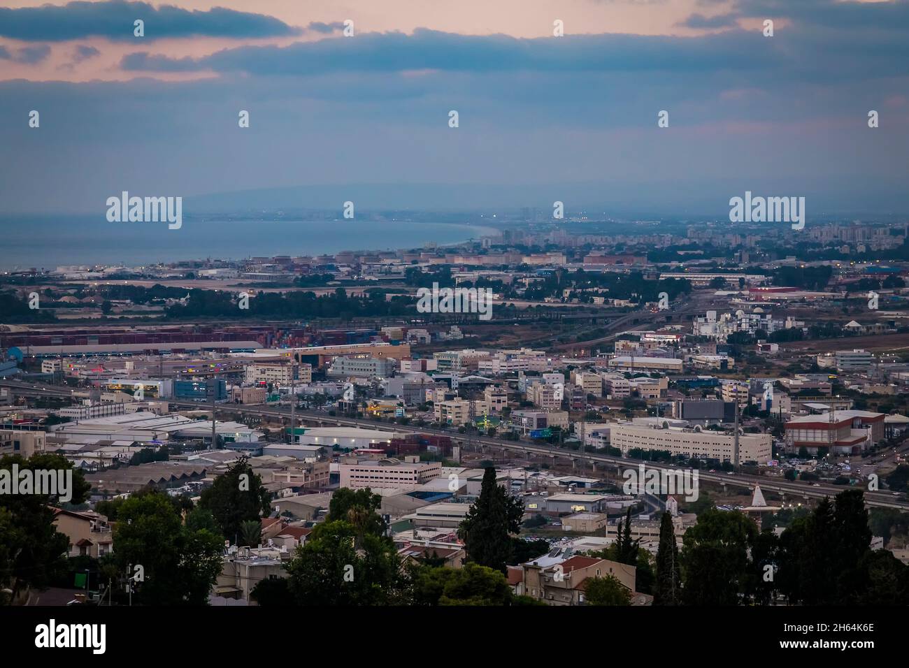 View of Haifa city downtrown and harbour port and sea at evening in ...