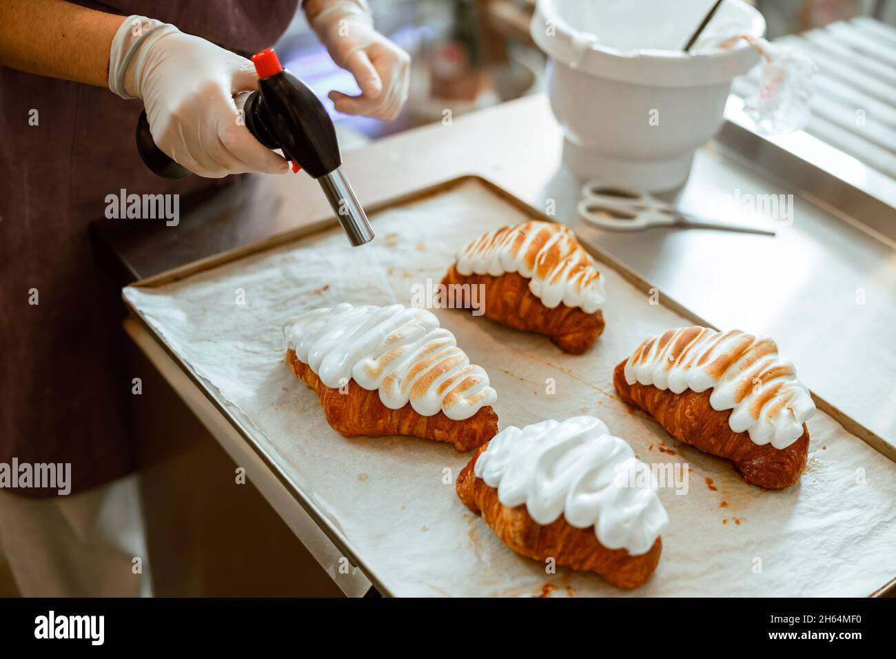 Hands with croissants gloves hi-res stock photography and images - Alamy