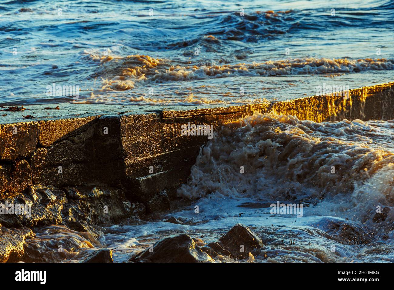 Waves lapping over the slipway Stock Photo - Alamy