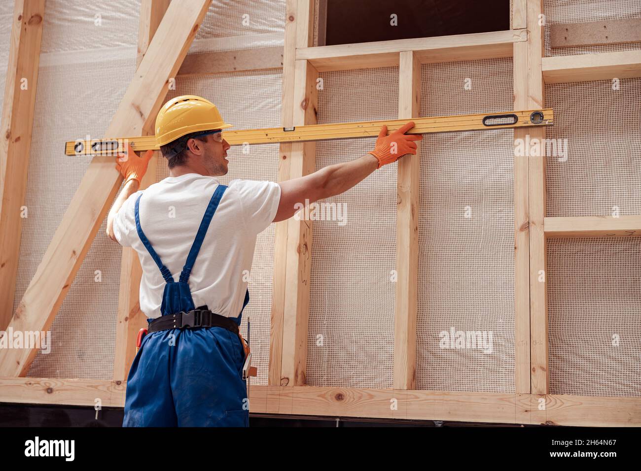 Male builder in safety helmet working at construction site Stock Photo ...
