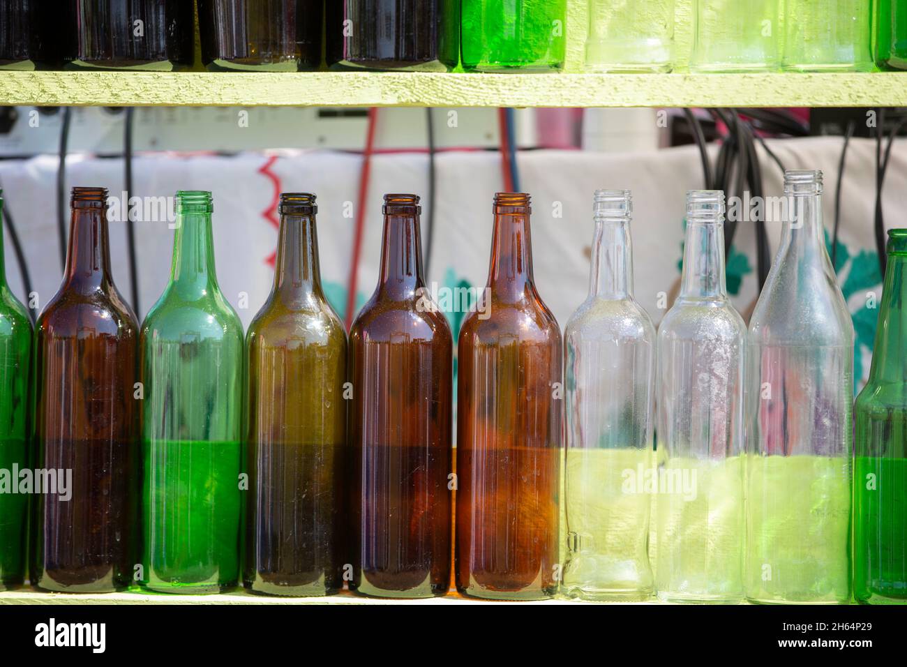 Vintage glass multi-colored bottles are in a row Stock Photo - Alamy