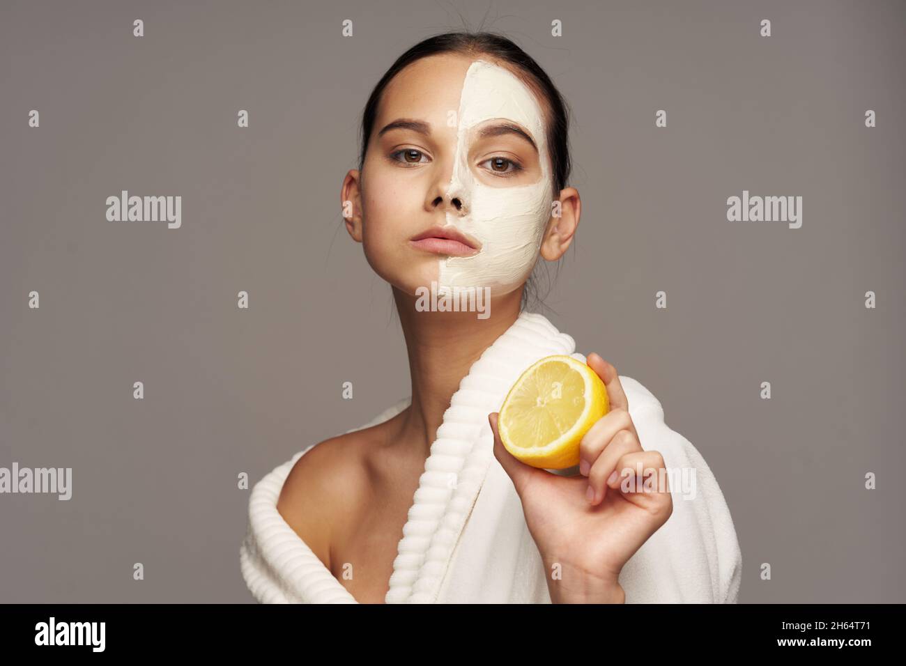 pretty woman face cream lemon skin care health Stock Photo - Alamy