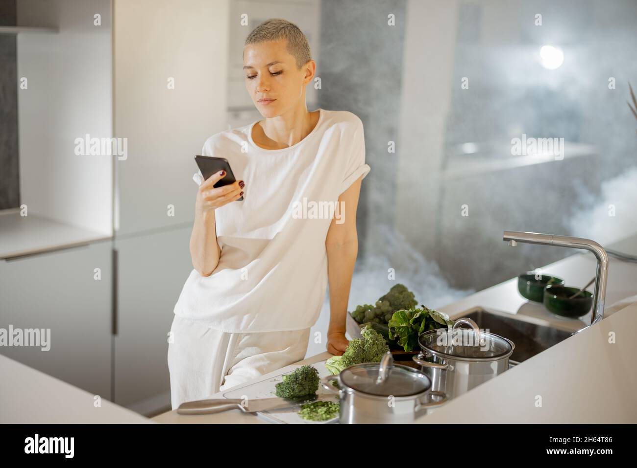 Woman cooking kitchen mess hi-res stock photography and images - Alamy