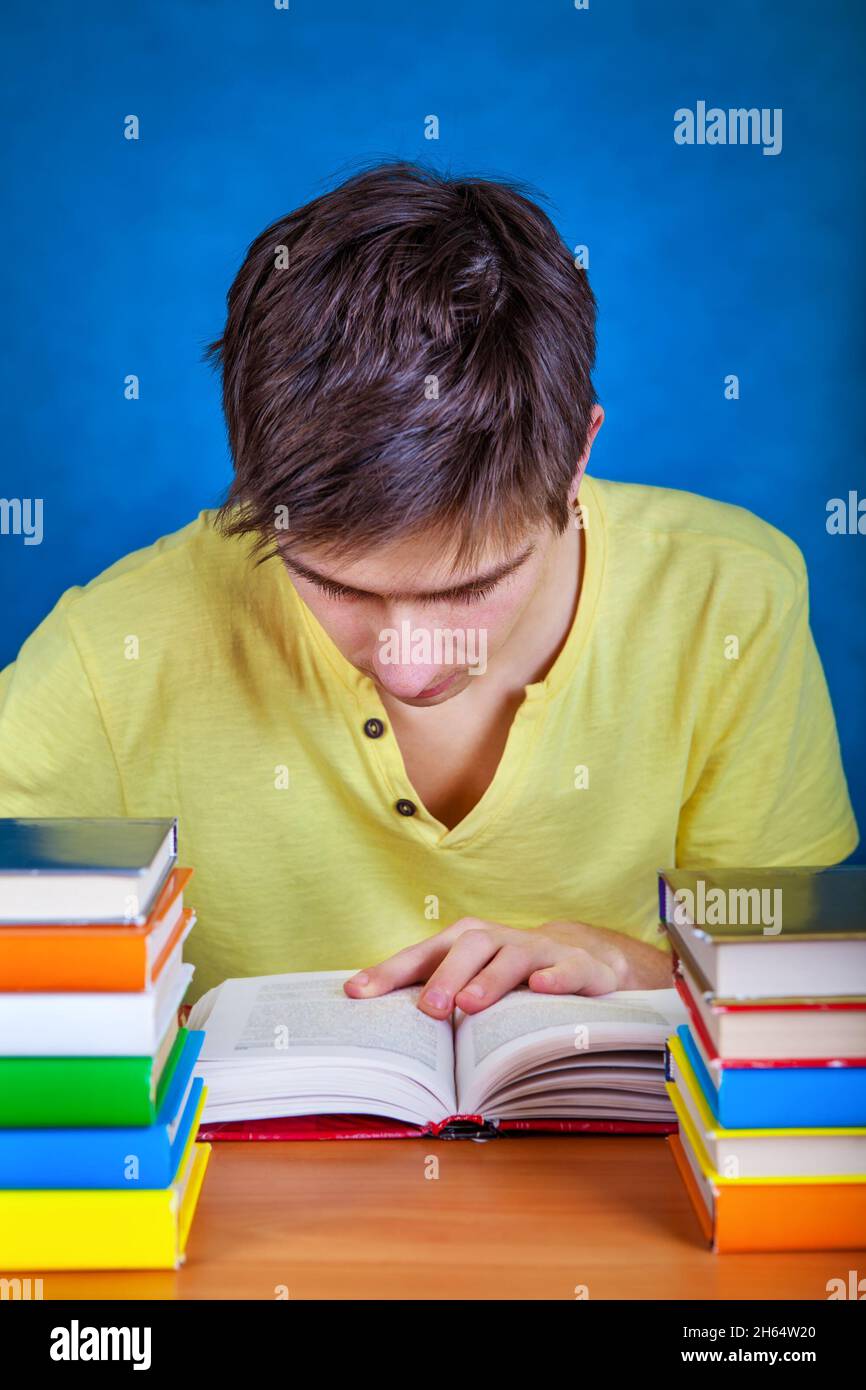 Student with the Books on the School Desk Stock Photo - Alamy