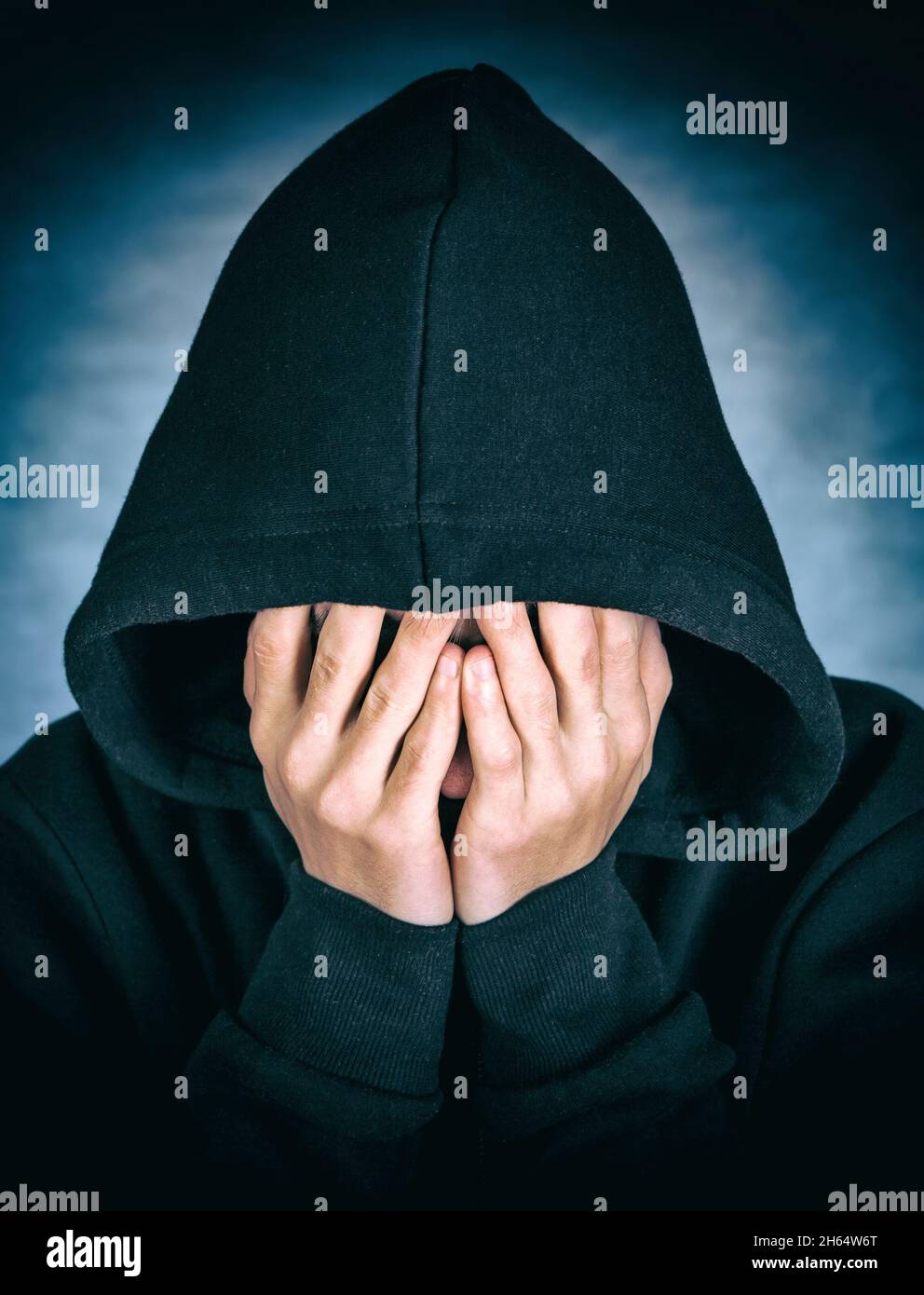 Vignetting Photo of Sad Man in the Hood on the Dark Background Stock ...