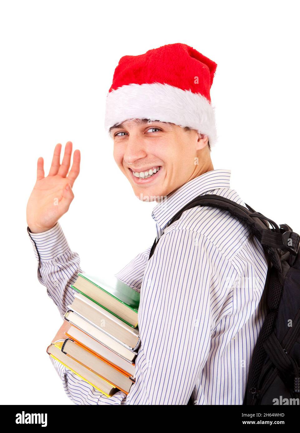 Cheerful Student in Santa Hat with a Books on the White Background ...