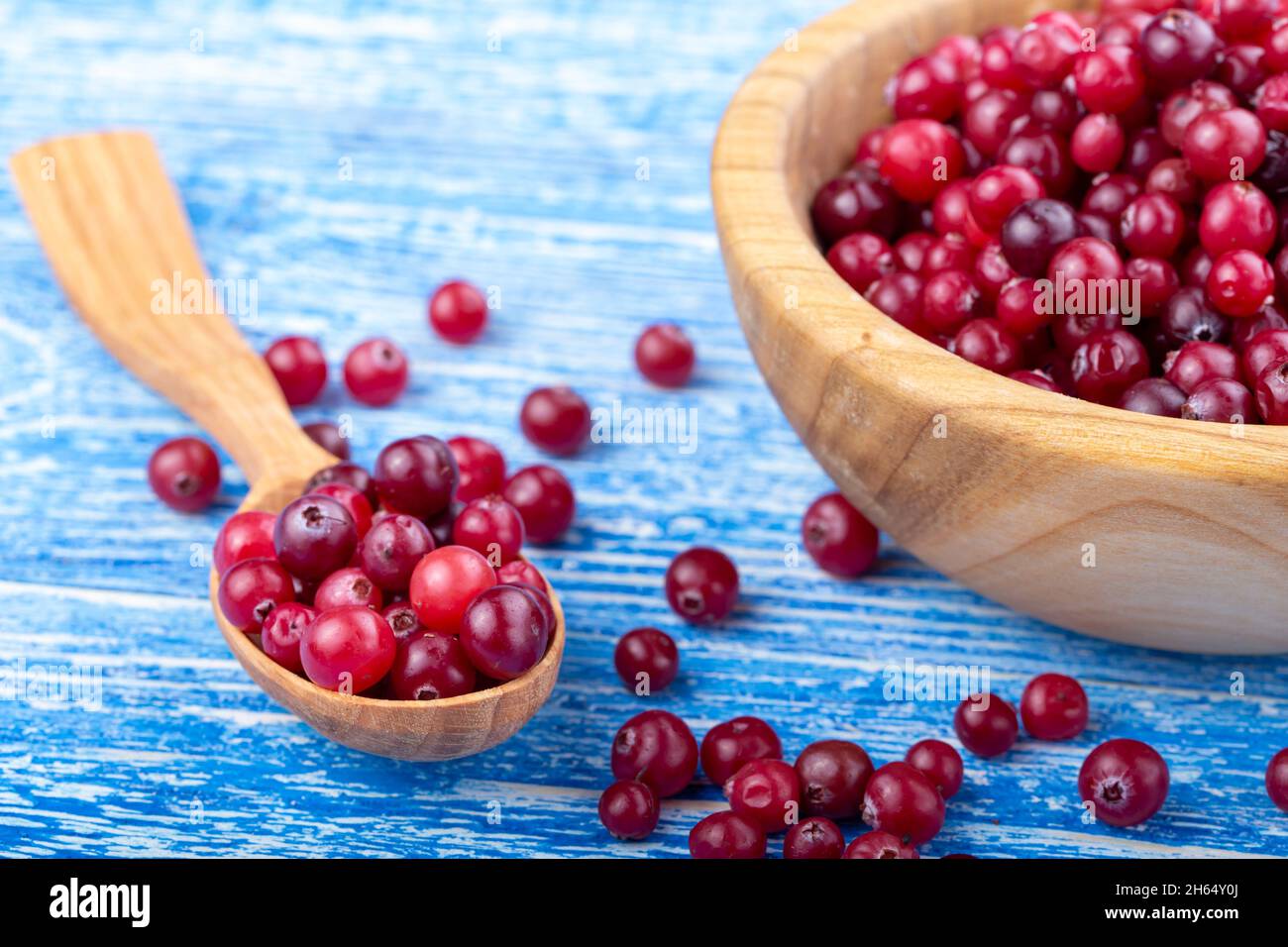 Ripe cranberries in a wooden bowl. Healthy food concept Stock Photo - Alamy