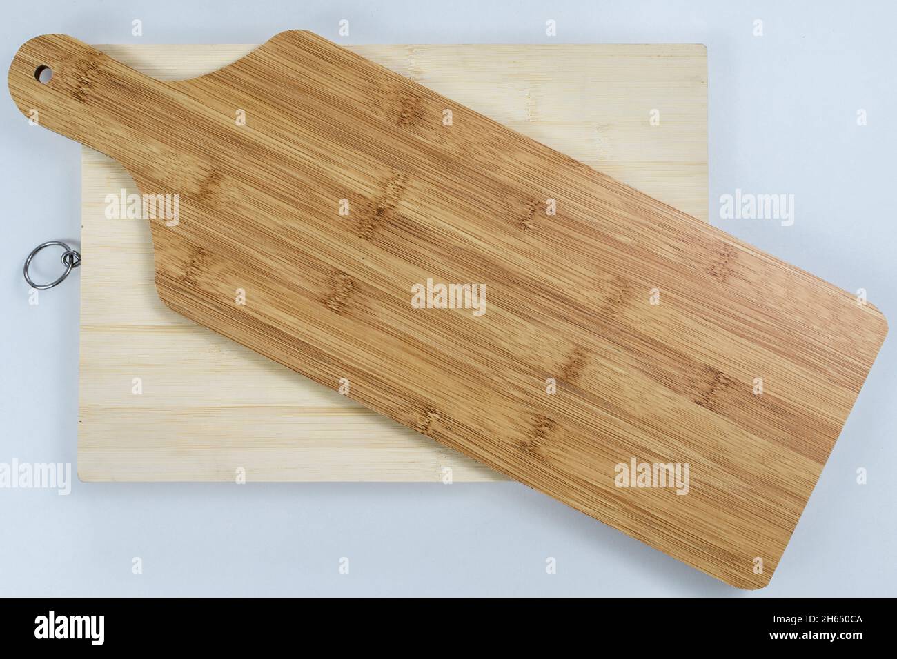 Wooden chopping boards on the white table Stock Photo - Alamy