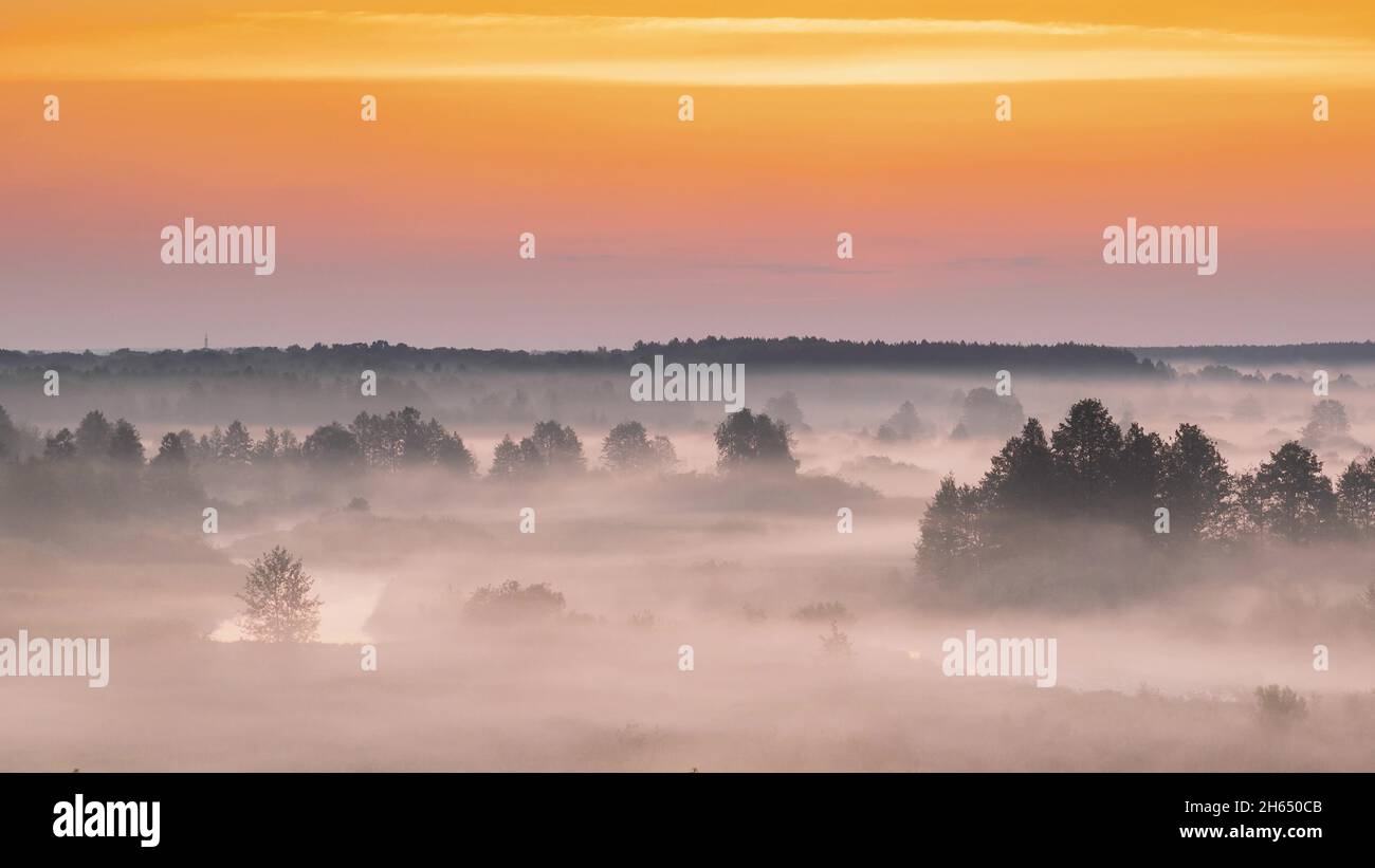 Amazing Sunrise Over Misty Landscape. Scenic View Of Foggy Morning Sky ...